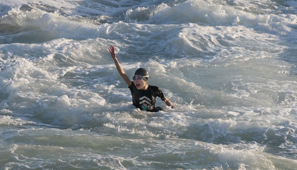 A woman’s dramatic beach rescue was captured by nearby photographers
