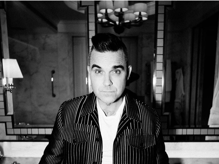 Hands-on Dad Robbie Williams Cradles New Son Beau